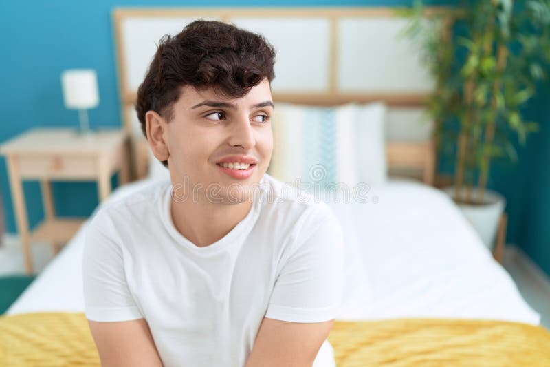 Non Binary Man Smiling Confident Sitting on Bed at Bedroom Stock Image ...