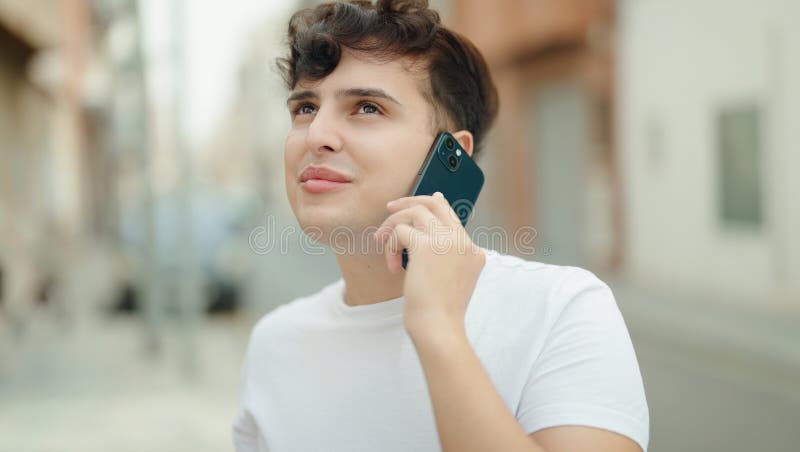 Non Binary Man Smiling Confident Talking on Smartphone at Street Stock ...