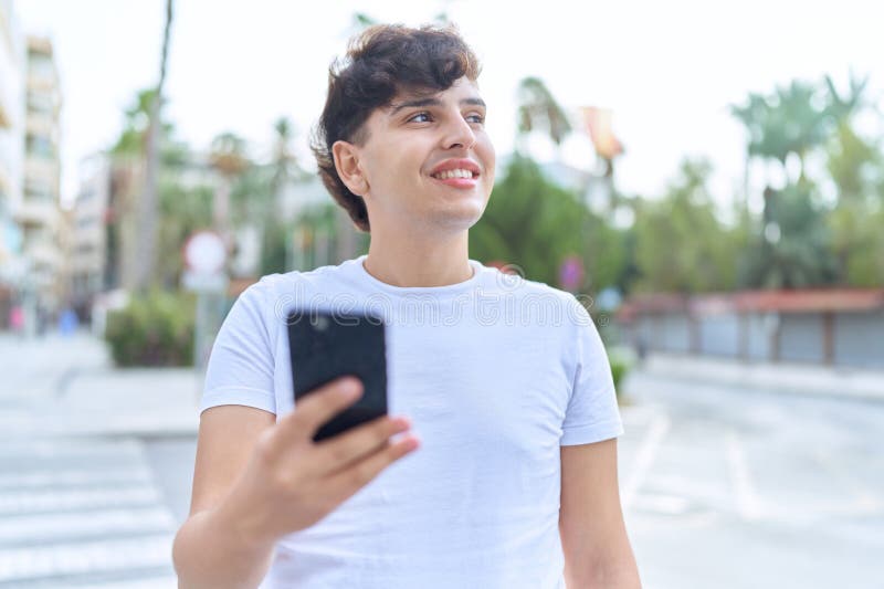 Non Binary Man Smiling Confident Using Smartphone at Street Stock Photo ...
