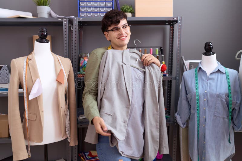 Non Binary Man Tailor Smiling Confident Holding Jacket at Atelier Stock ...