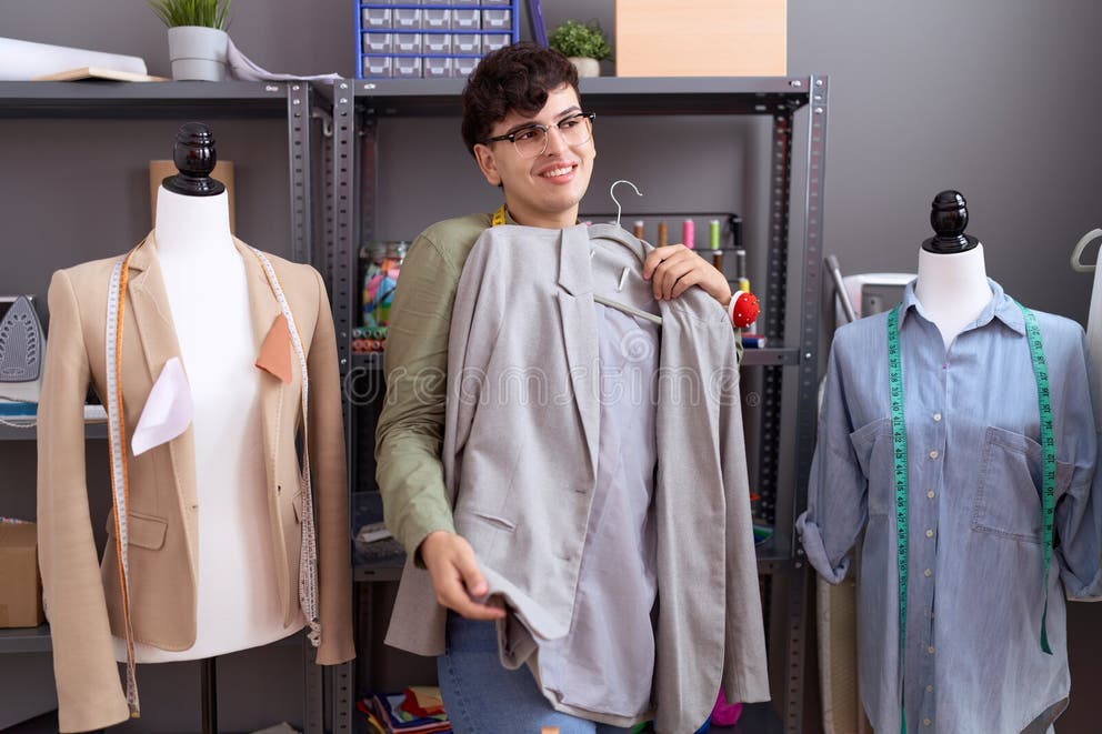 Non Binary Man Tailor Smiling Confident Holding Jacket at Atelier Stock ...