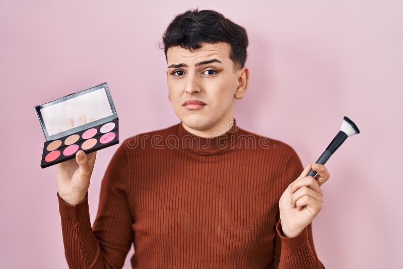 Non Binary Person Holding Makeup Brush and Blush Clueless and Confused ...