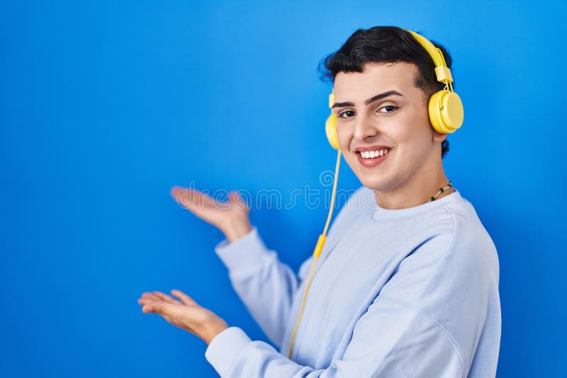 Non Binary Person Listening To Music Using Headphones Inviting To Enter ...