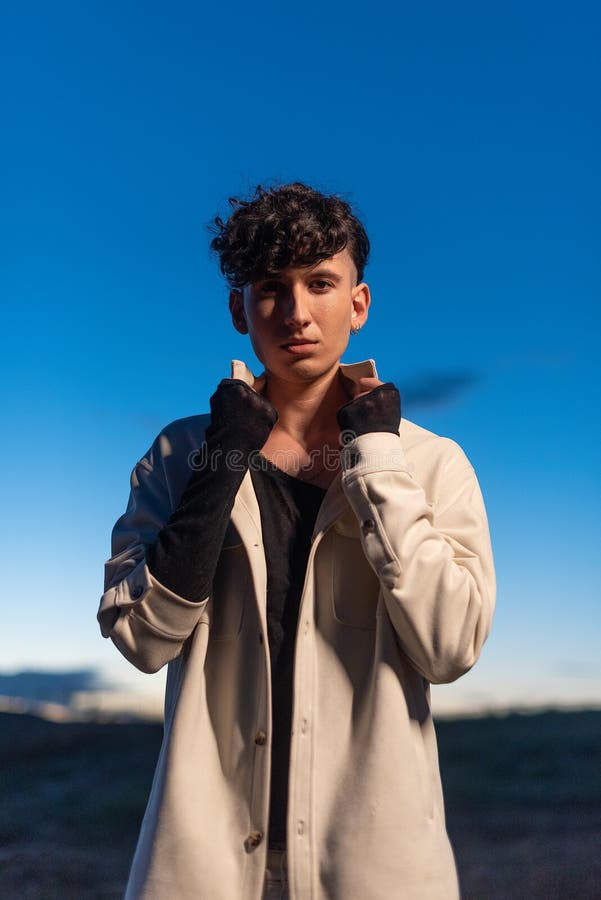 Non Binary Person Standing with Confident Attitude Outdoors Stock Photo ...