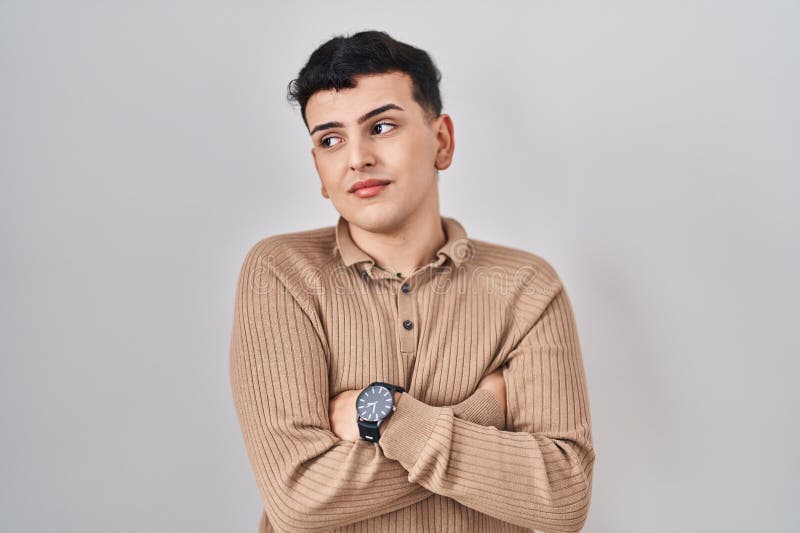 Non Binary Person Standing Over Isolated Background Looking To the Side ...