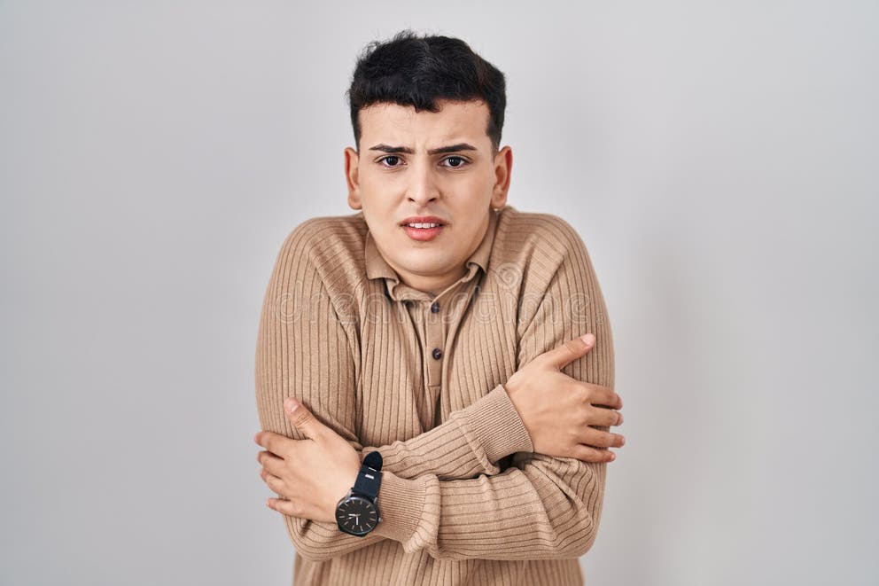 Non Binary Person Standing Over Isolated Background Shaking and ...