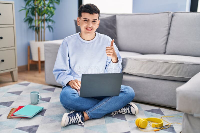 Non Binary Person Studying Using Computer Laptop Sitting on the Floor ...