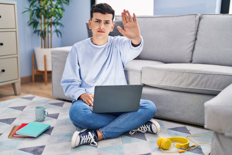 Non Binary Person Studying Using Computer Laptop Sitting on the Floor ...