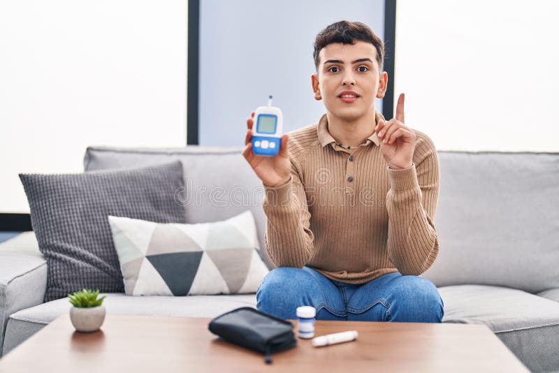 Non Binary Person Using Blood Pressure Monitor Surprised with an Idea ... Non Binary Person Using Blood Pressure Monitor Surprised with an Idea ...