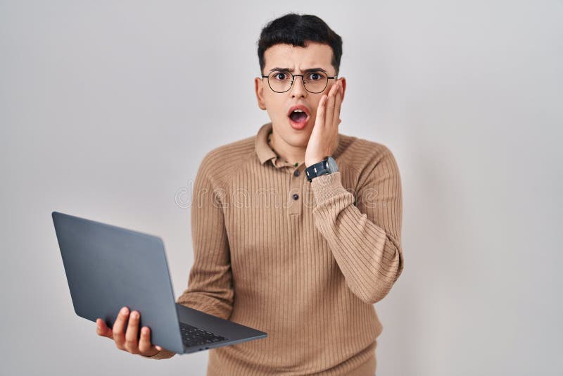 Non Binary Person Using Computer Laptop Afraid and Shocked, Surprise ...