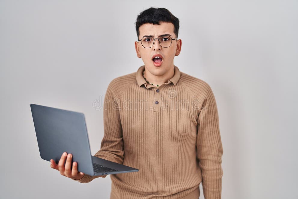 Non Binary Person Using Computer Laptop in Shock Face, Looking ...