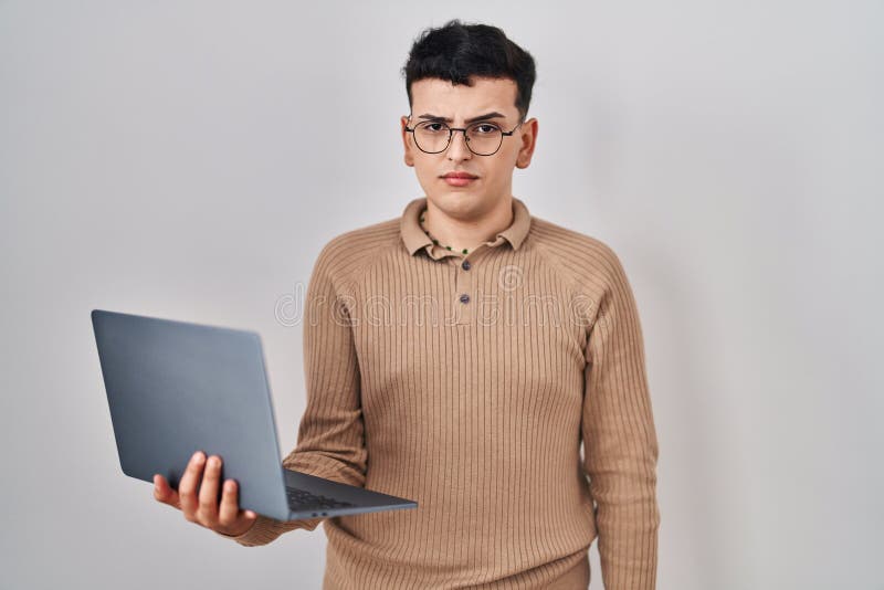 Non Binary Person Using Computer Laptop Skeptic and Nervous, Frowning ...