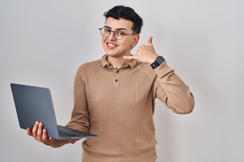 Non Binary Person Using Computer Laptop Smiling Doing Phone Gesture ...