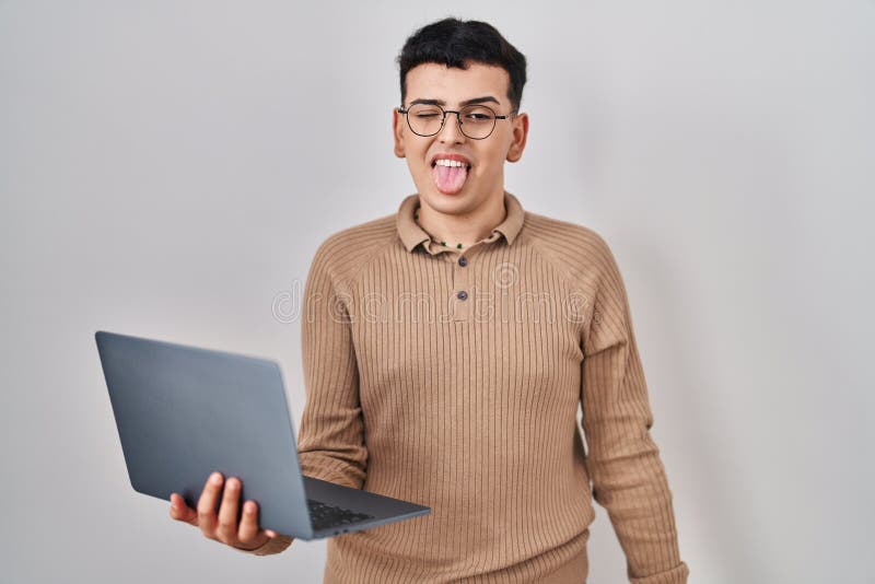 Non Binary Person Using Computer Laptop Sticking Tongue Out Happy with ... Non Binary Person Using Computer Laptop Sticking Tongue Out Happy with ...
