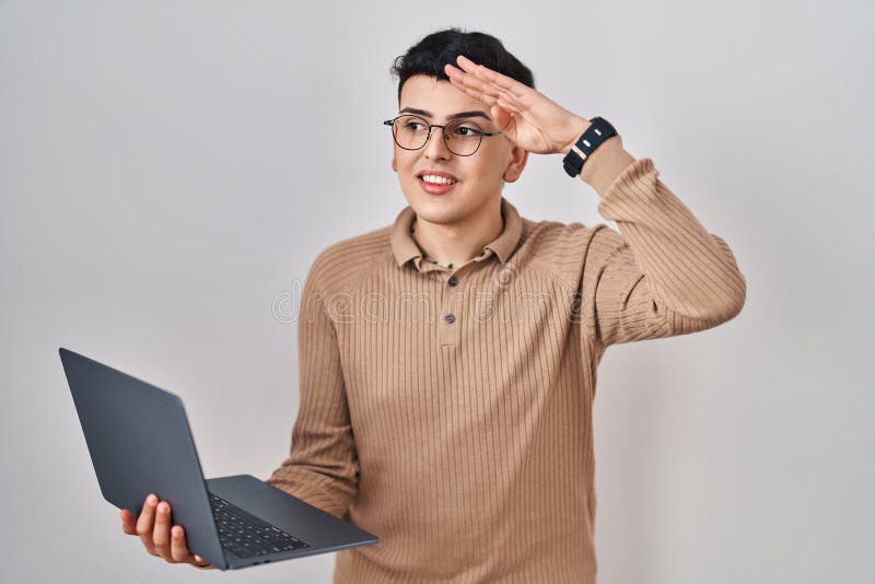 Non Binary Person Using Computer Laptop Very Happy and Smiling Looking ...