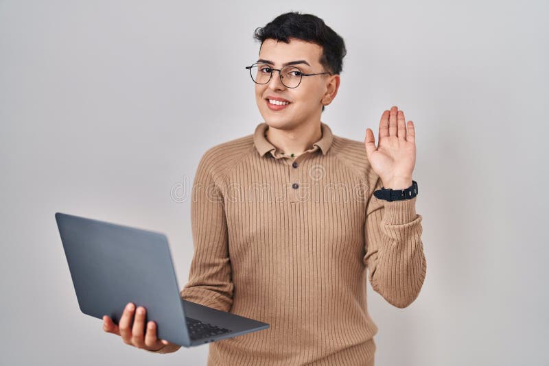 Non Binary Person Using Computer Laptop Waiving Saying Hello Happy and ... Non Binary Person Using Computer Laptop Waiving Saying Hello Happy and ...