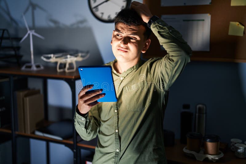 Non Binary Person Using Touchpad Device at Night Confuse and Wondering ...