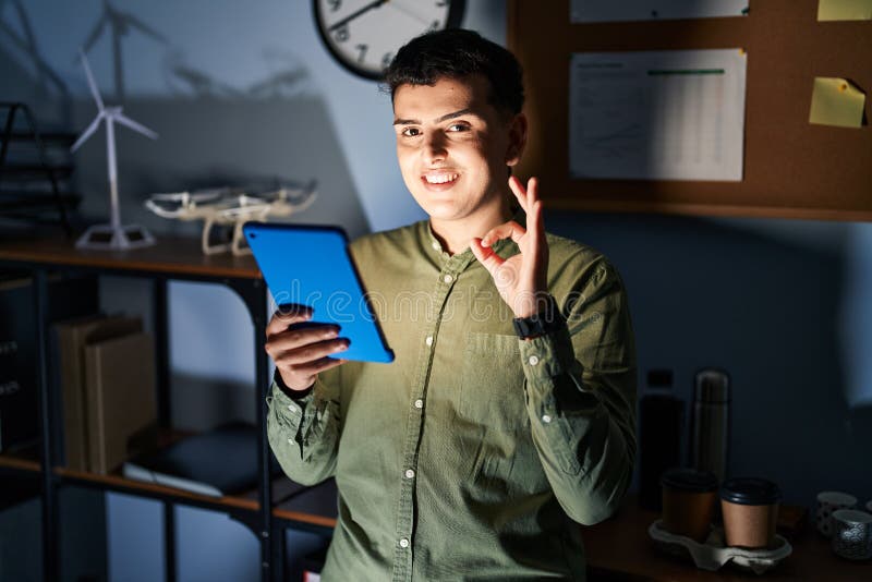 Non Binary Person Using Touchpad Device at Night Smiling Positive Doing ...