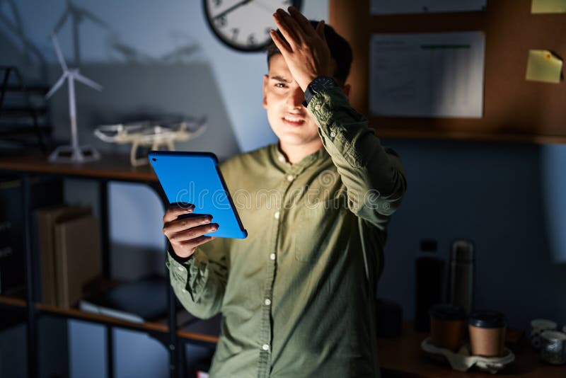 Non Binary Person Using Touchpad Device at Night Surprised with Hand on ...