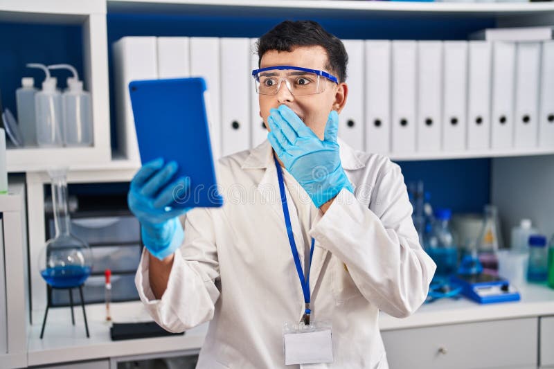 Non Binary Person Working at Scientist Laboratory Using Tablet Covering ...