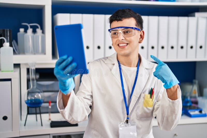Non Binary Person Working at Scientist Laboratory Using Tablet Smiling ...