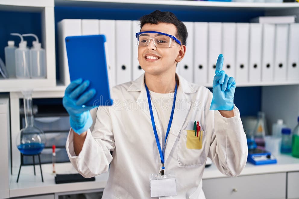 Non Binary Person Working at Scientist Laboratory Using Tablet Smiling ...
