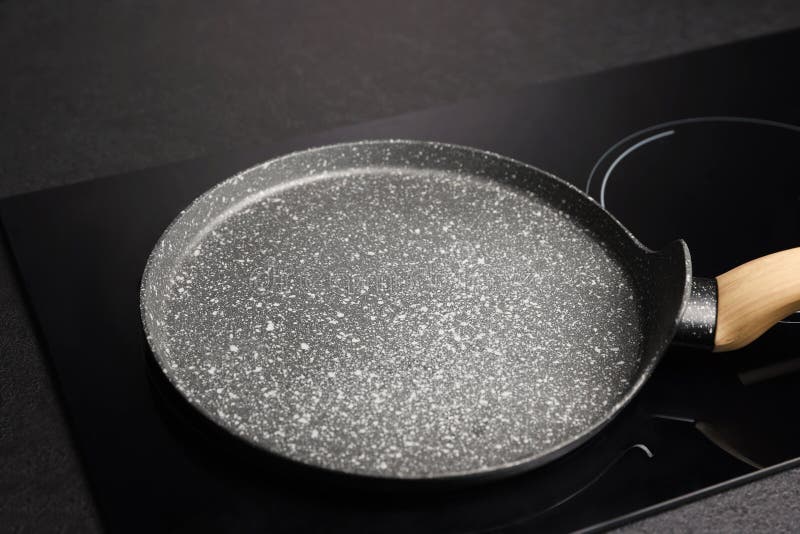 Nonstick Frying Pan on Stove in Kitchen Stock Photo - Image of material ...
