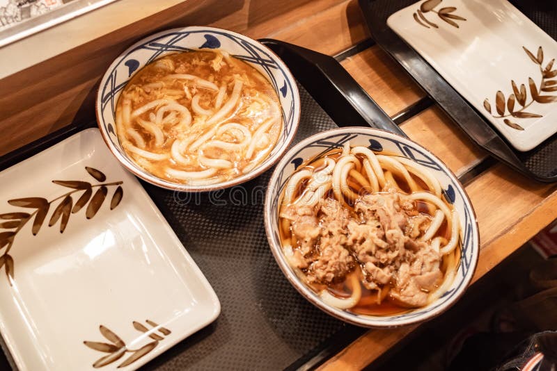 Delicious Udon Menu Served in Bowls on a Tray at a Japanese Restaurant ...