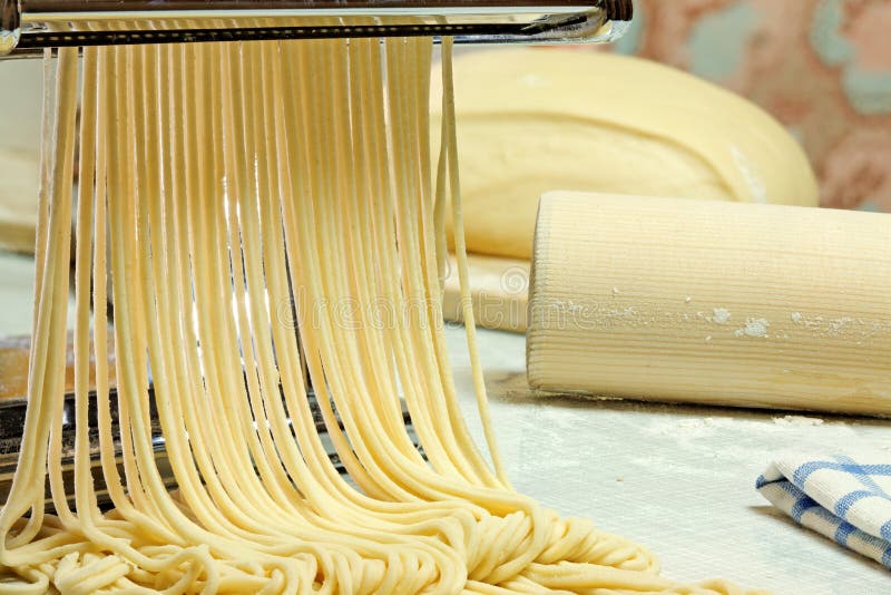 Noodles and pasta machine. stock image. Image of dough - 19804561