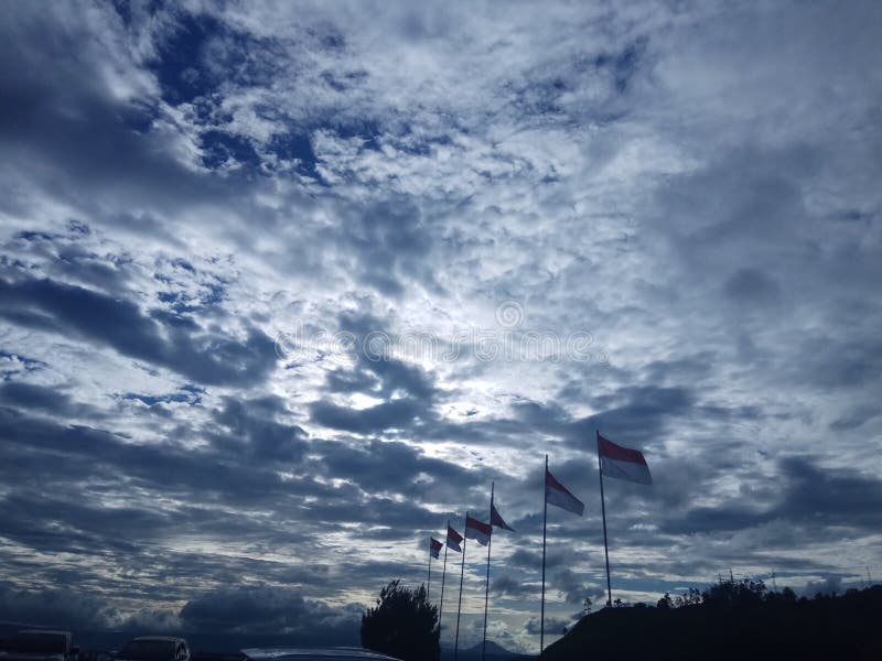 Noon sky stock image. Image of flag, dark, weather, noon - 168066797