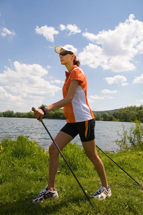 Nordic walking at sunset stock image. Image of mountain - 61346837
