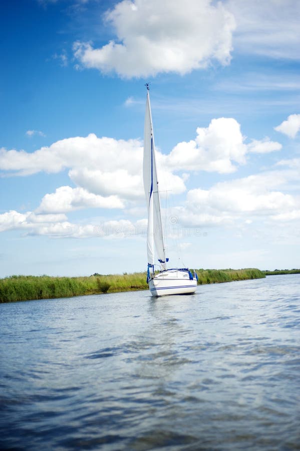 Norfolk Broads Sail Boat Sailing Down a River Stock Photo - Image of weather, clouds: 27961406