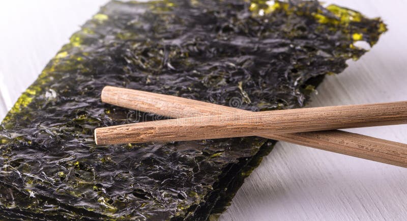 Nori Sheets. Nori Sheets with Sticks on the Wood Dish on Sunlight Stock ...