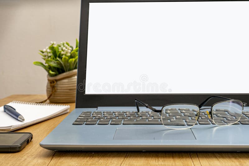 Normal View of an Open Laptop, a Pair of Glasses on the Keyboard Ready ...