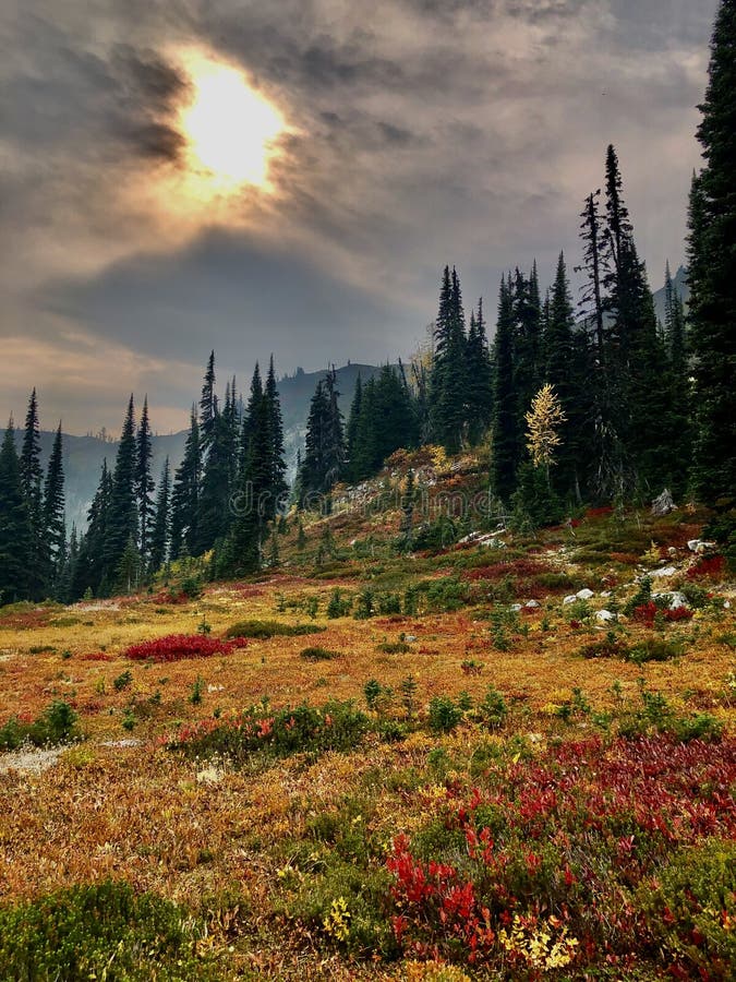 North Cascades Sun Burning through Clouds during Fall. Stock Photo ...