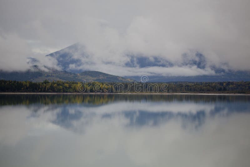 Northern BC Lake with Reflection, Mist, Fall Tones Stock Photo - Image ...