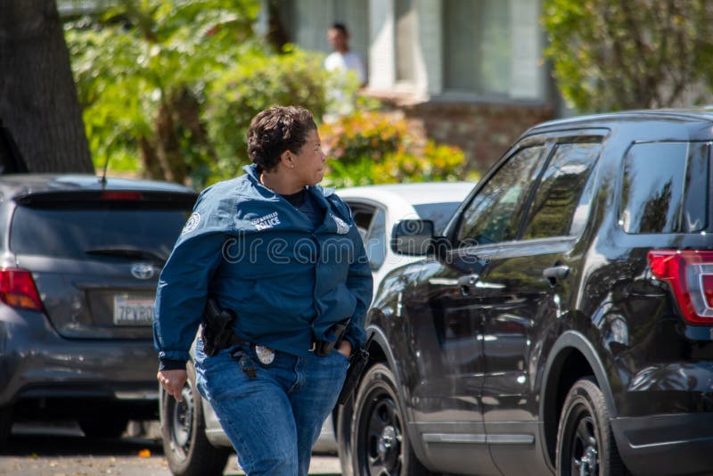 A Black Female Detective From Lapd`s Metro Division Walks By Police
