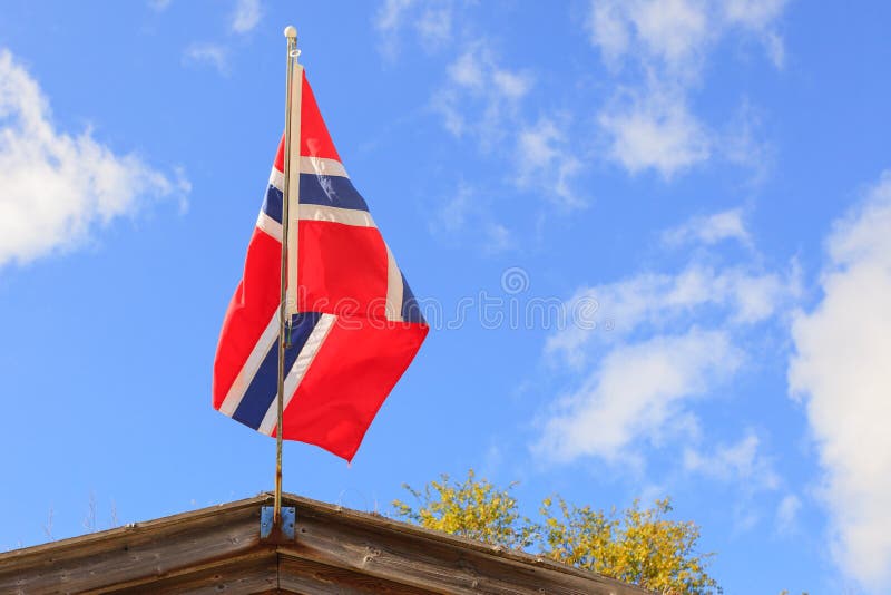 The Norwegian Flag Against Blue Sky Stock Photo - Image of scandinavia ...