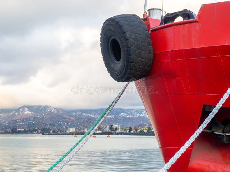 Nose of the Ship is Red. Tire on the Bow of the Ship. Safety Stock ...