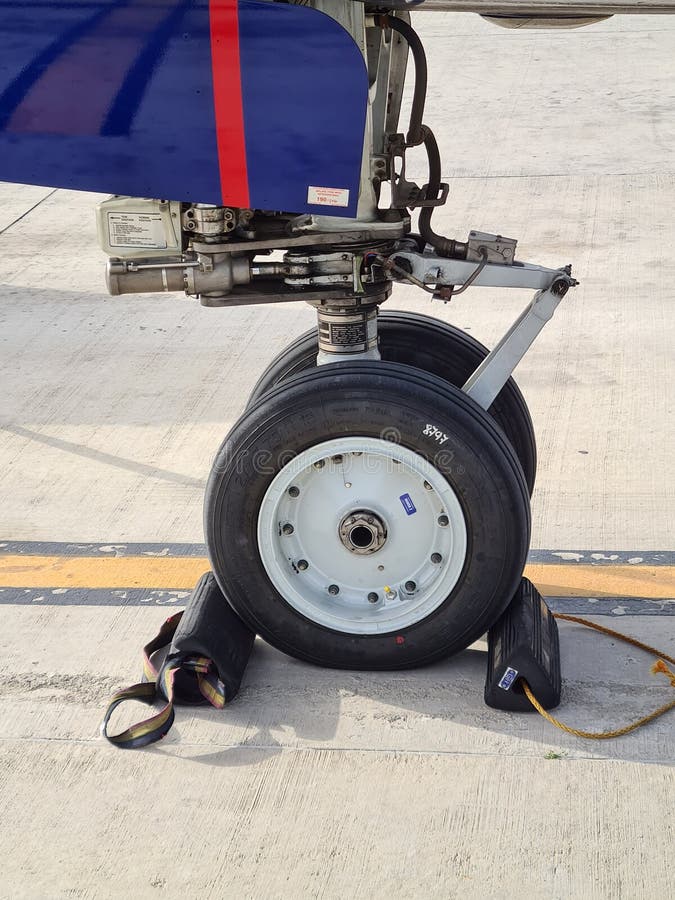 Nose wheel of an airliner stock image. Image of landing - 267281739