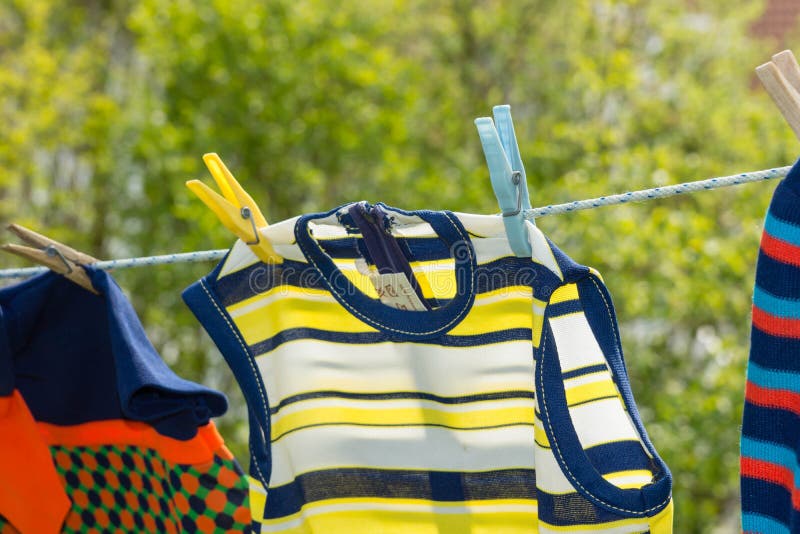 Nostalgic Kids Clothes on the Line Stock Photo - Image of girl, colored ...