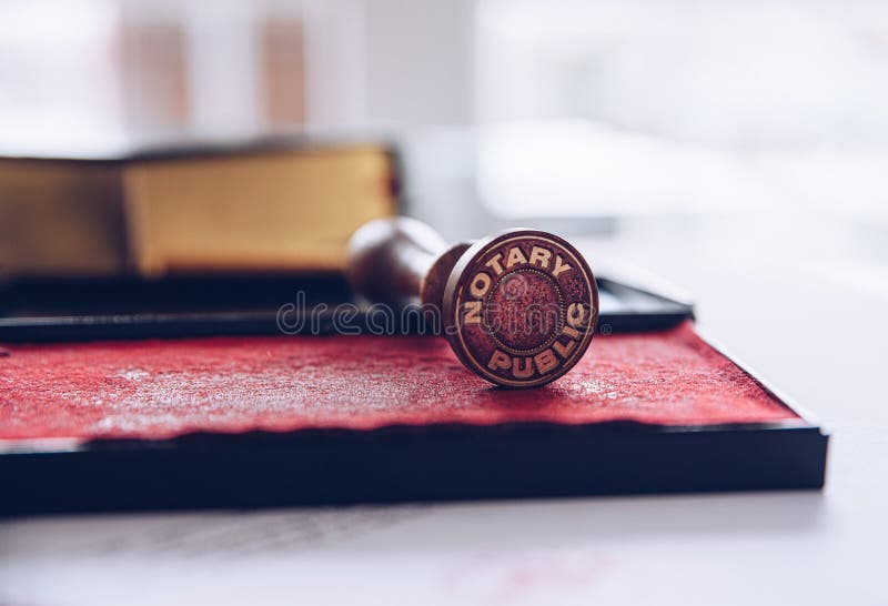 Notary Public Stamp on Red Ink Pad Stock Photo - Image of stamp ...