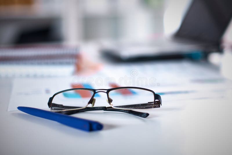 A Note Book, Laptop, Pen, Graph Paper Document on the Office De Stock ...