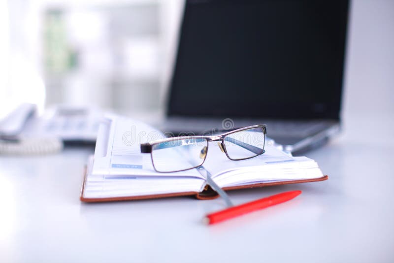 A Note Book, Laptop, Pen, Graph Paper Document on the Office Desk Table ...