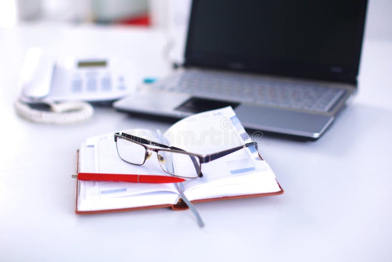 A Note Book, Laptop, Pen, Graph Paper Document on the Office Desk Table ...