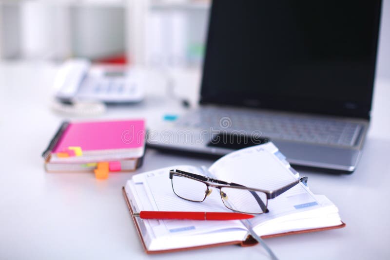 A Note Book, Laptop, Pen, Graph Paper Document on the Office Desk Table ...