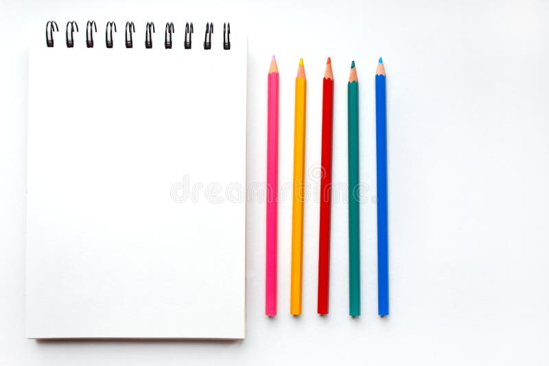 Note for Drawing and Colour Pencils on White Background. Stock Image ...