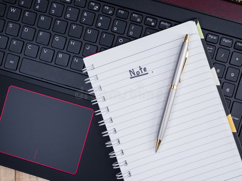 Note on laptop keyboard 1 stock photo. Image of notepad - 77426496