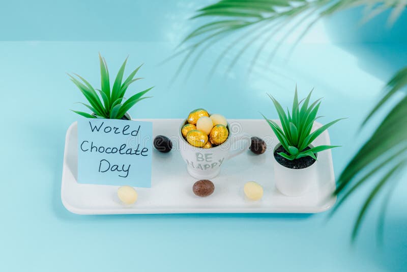 Note Paper World Chocolate Day with Mug of Candy Eggs Chocolate. Stock ...