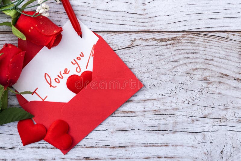Note that Says `I Love You` Inside an Envelope with Hearts and Roses on ...